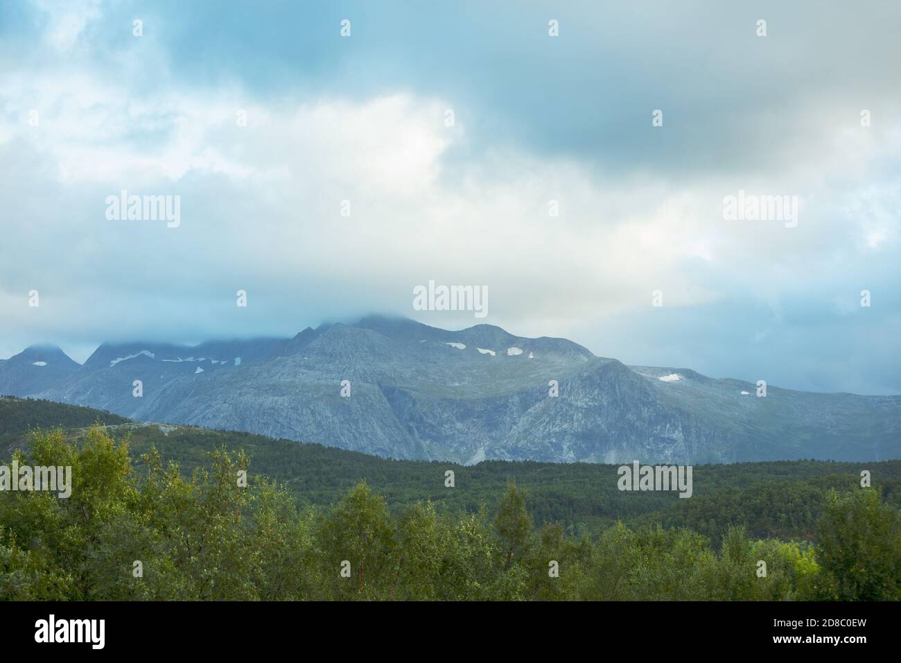 Mountain ridge against cloudy sky. Nature of Norway Stock Photo - Alamy