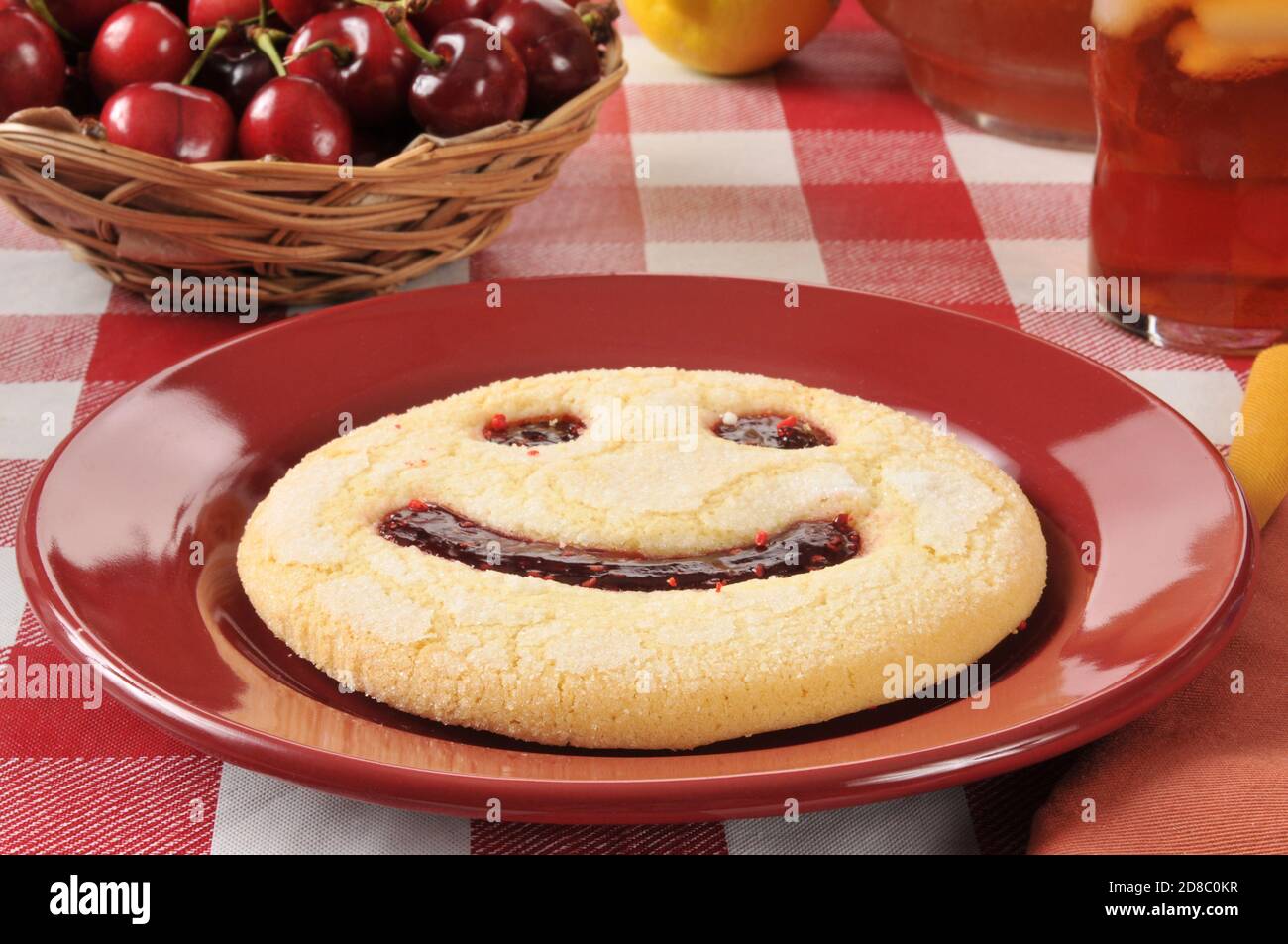 A large galletas cookie with a jam smiley face Stock Photo - Alamy