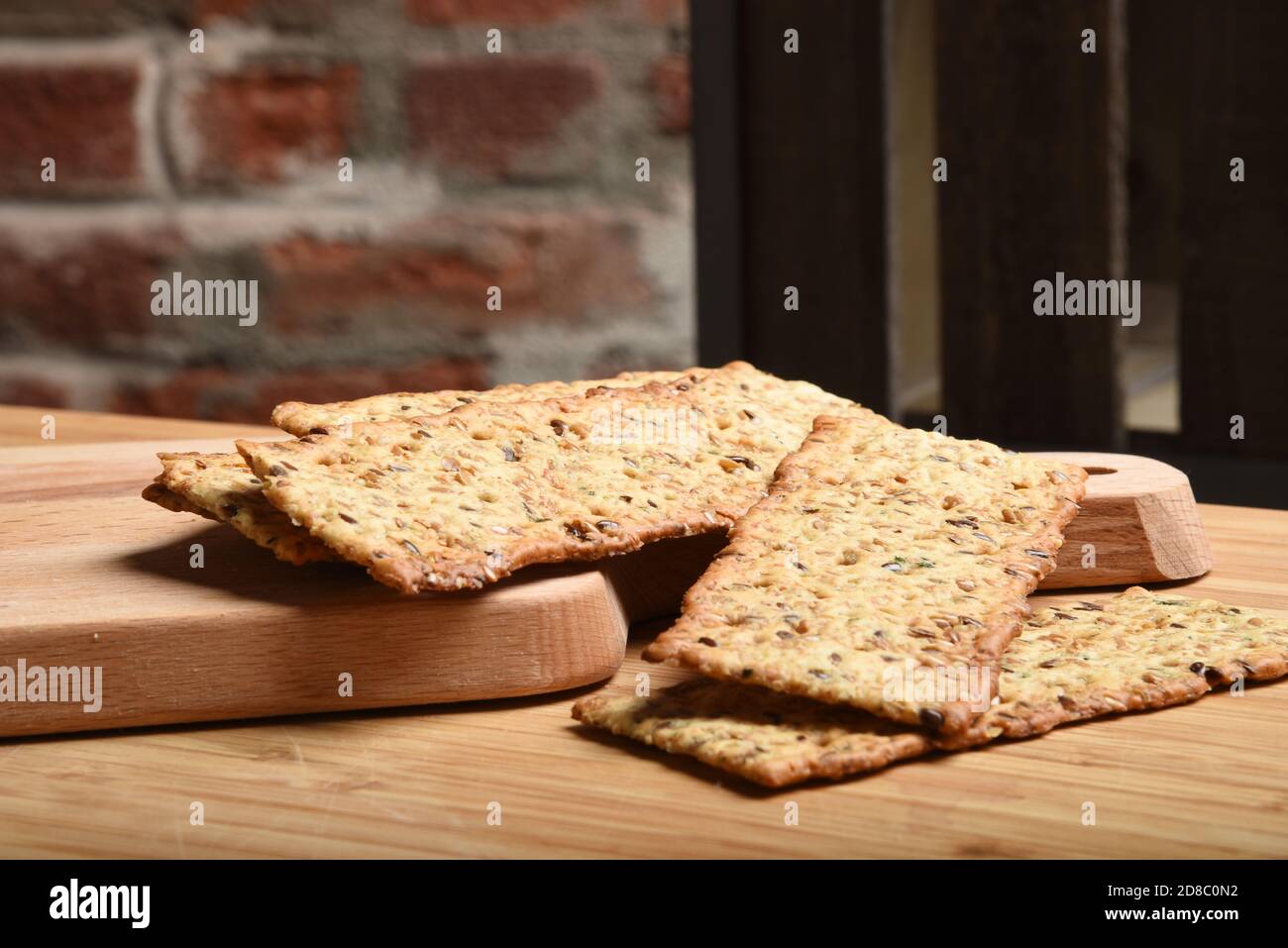 Stone ground whole wheat crackers with sesame seeds and spices Stock ...
