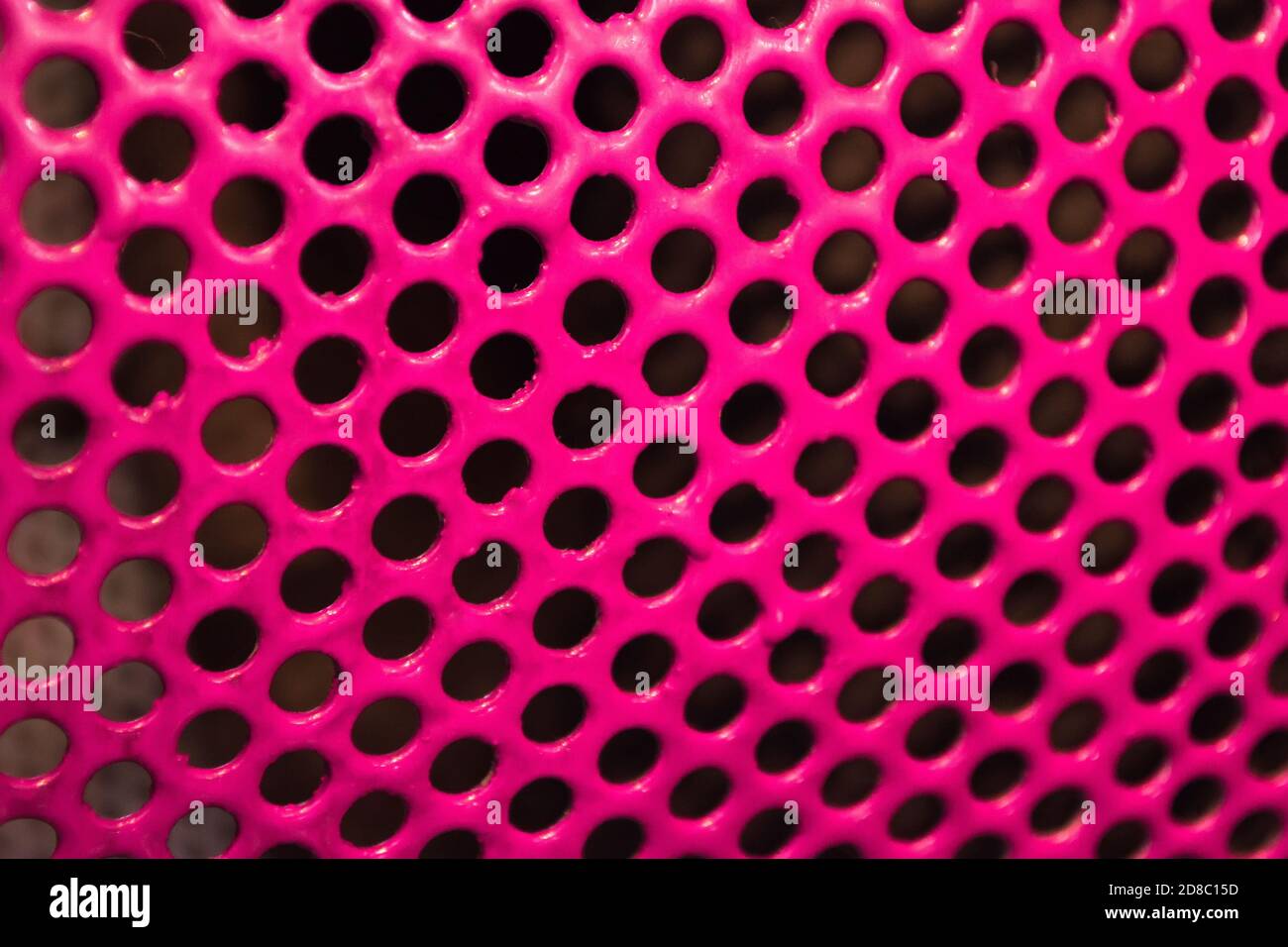 Texture metallic painted with pink glossy paint with black holes ...
