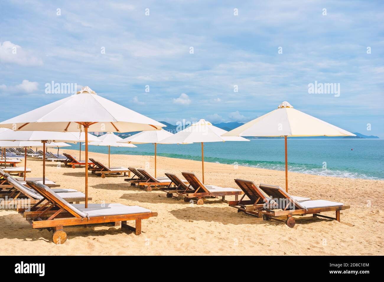White beach chairs with umbrella at the empty sea beach. Collapse of ...