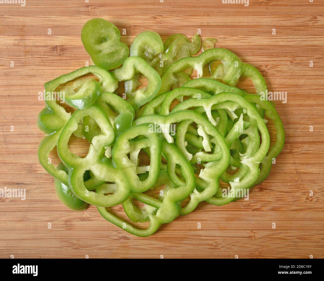 Overhead view of sliced green bell peppers Stock Photo - Alamy