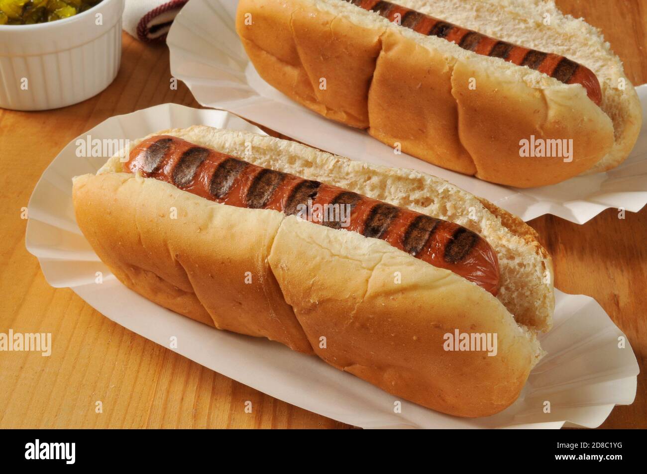 Grilled hot dogs waiting for the fixings Stock Photo - Alamy