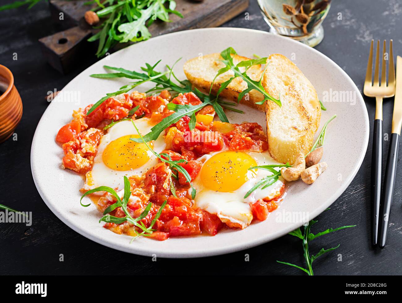 Late breakfast - fried eggs with vegetables. Shakshuka. Arabic cuisine ...