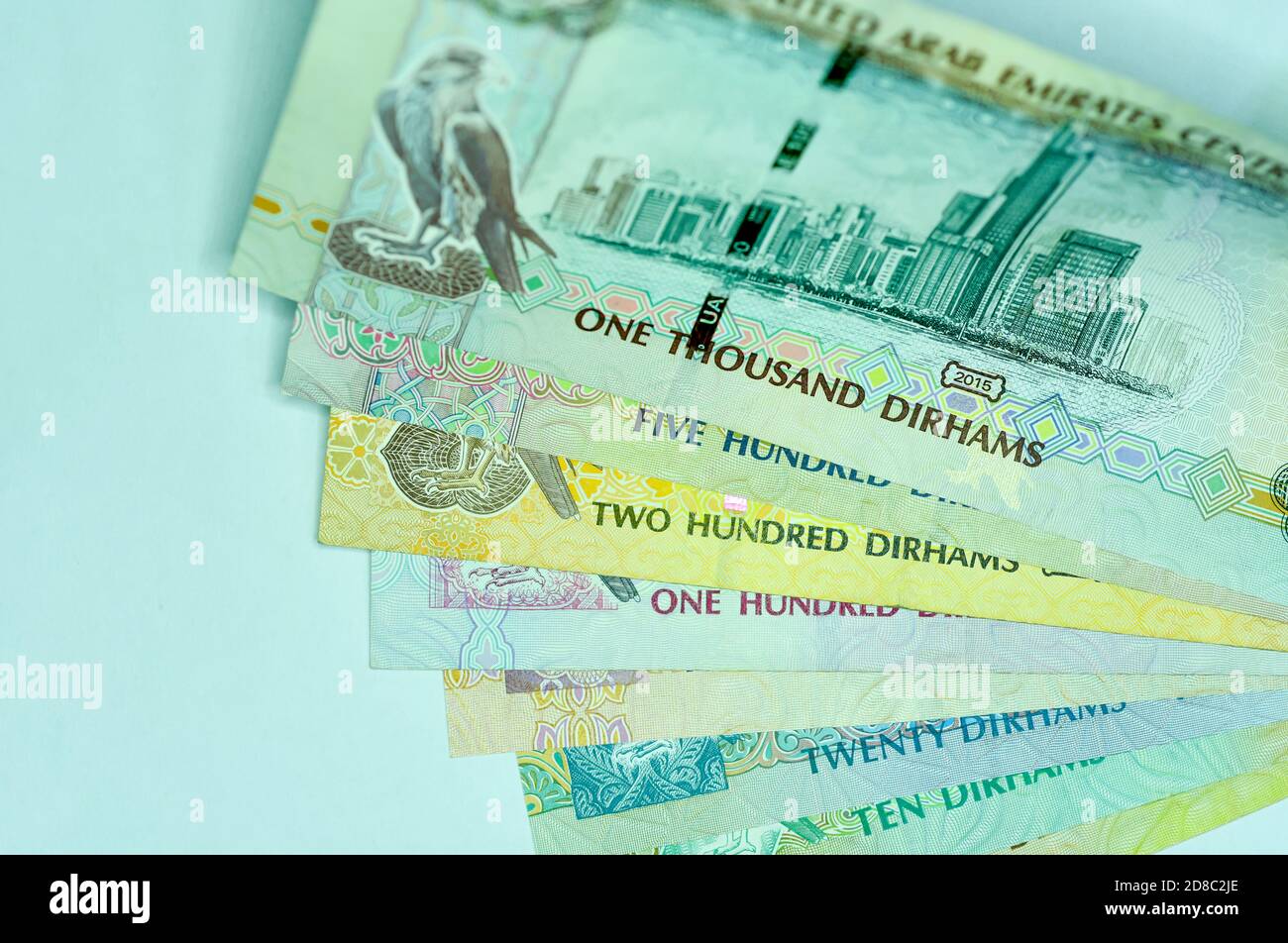 Top view of United Arab Emirates currency, dirhams isolated on a white ...