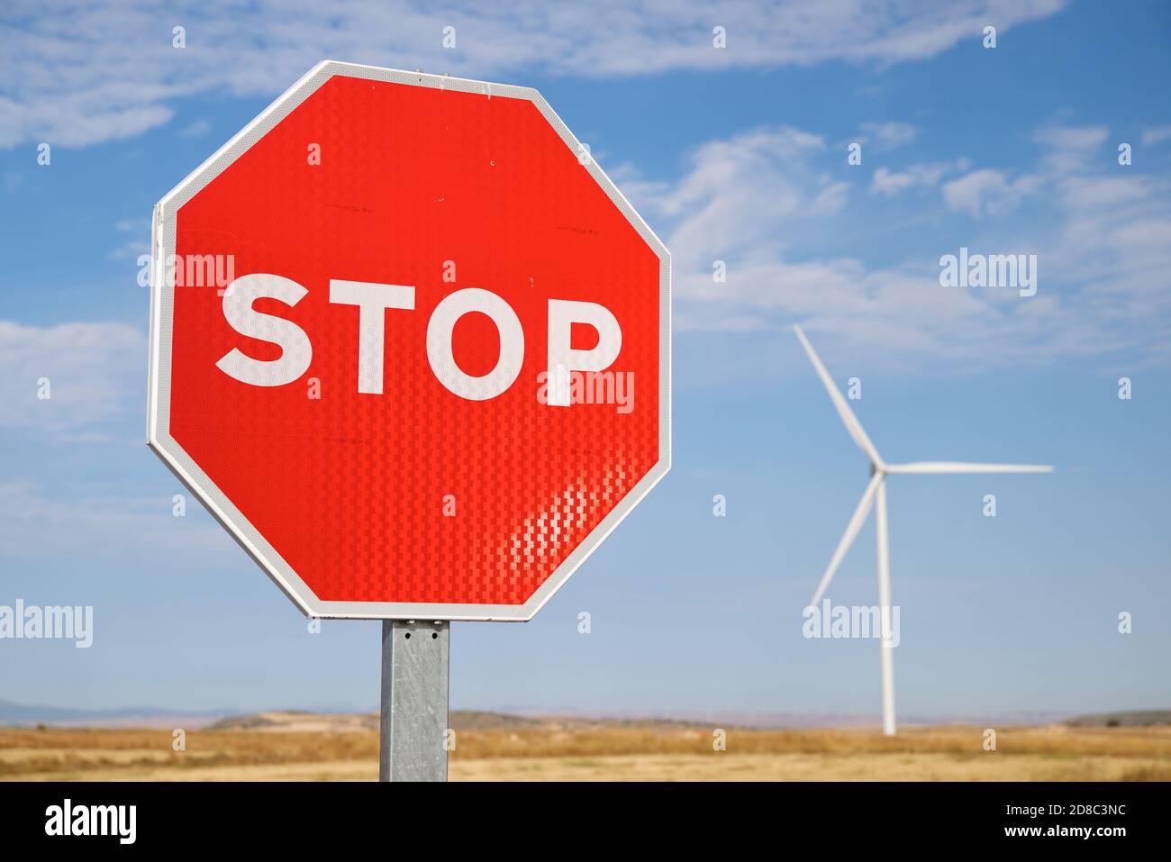 Stop traffic sign and windmill with clear blue sky Stock Photo - Alamy