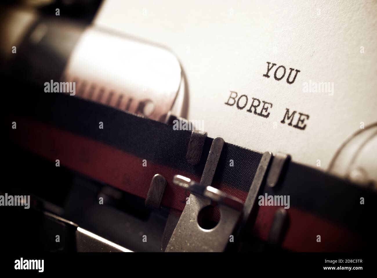 You bore me phrase written with a typewriter Stock Photo - Alamy