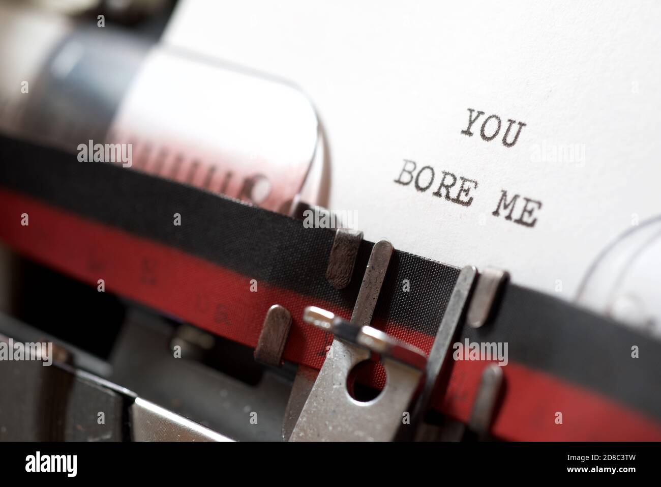 You bore me phrase written with a typewriter Stock Photo - Alamy
