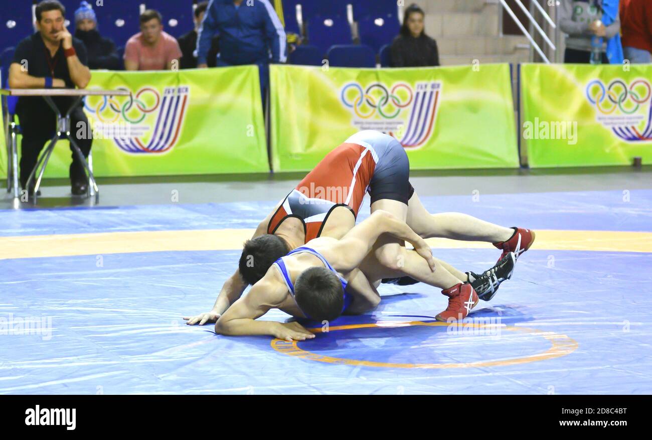 Orenburg, Russia - March 15-16, 2017: Young men compete in the sports ...