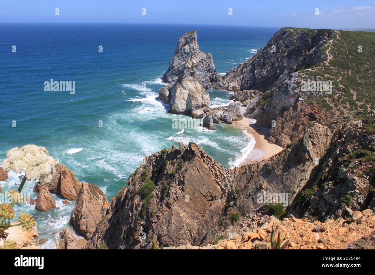 Landscape of cliffs covered in the grass surrounded by the sea under ...