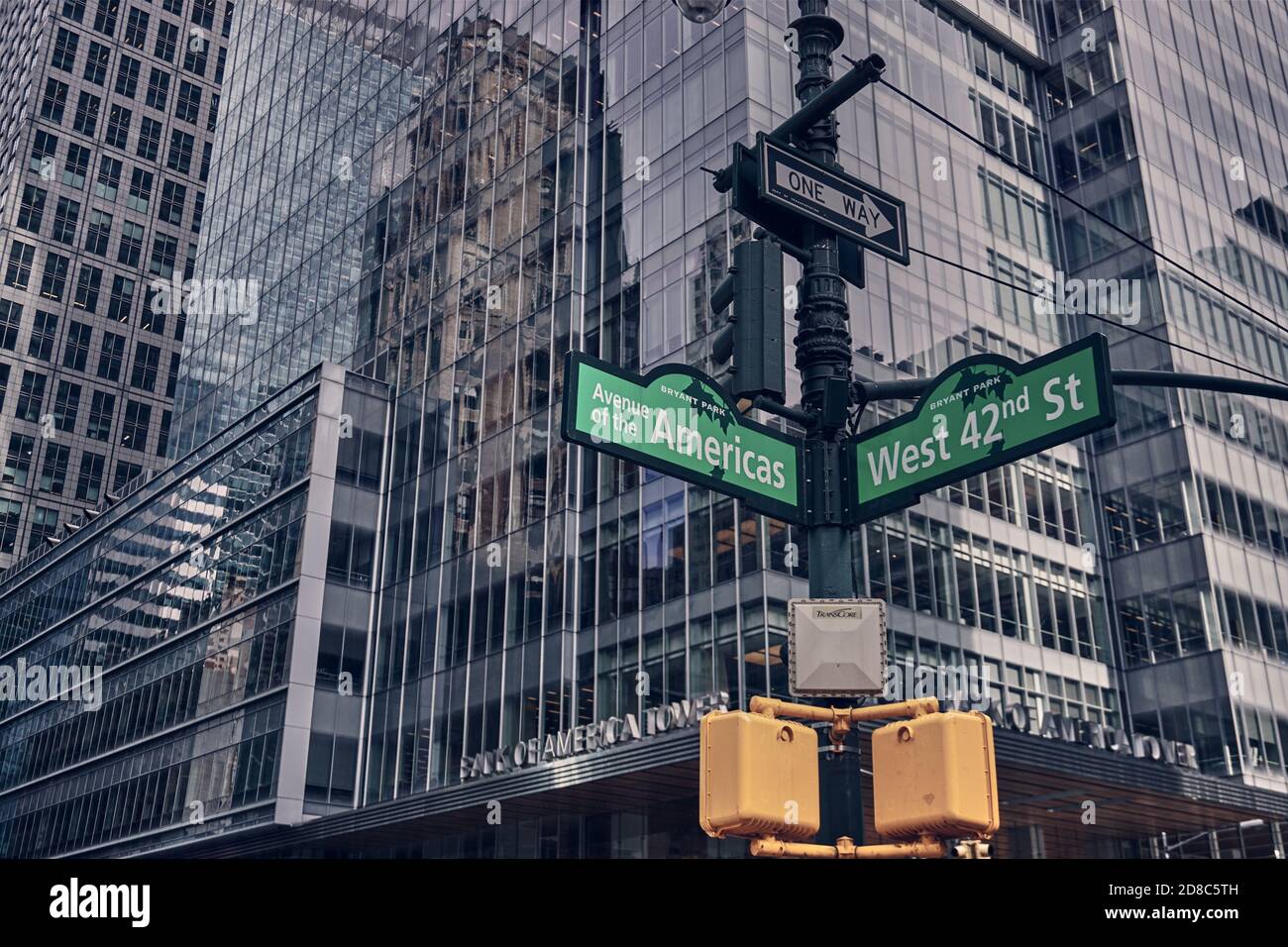 Street signs in Bryant Park, NYC with modern skyscrapers in the ...