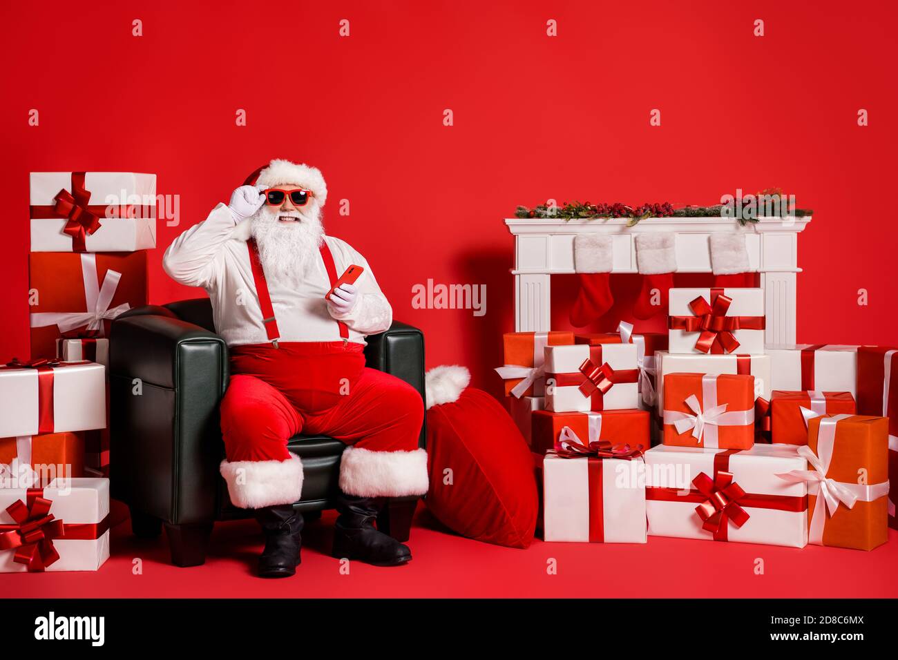 Portrait of his he nice attractive funky fat cheerful Santa using ...