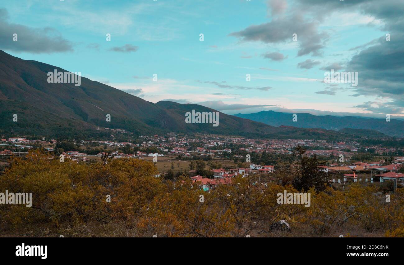 Aerial view of a town in a valley under a cloudy sky Stock Photo - Alamy