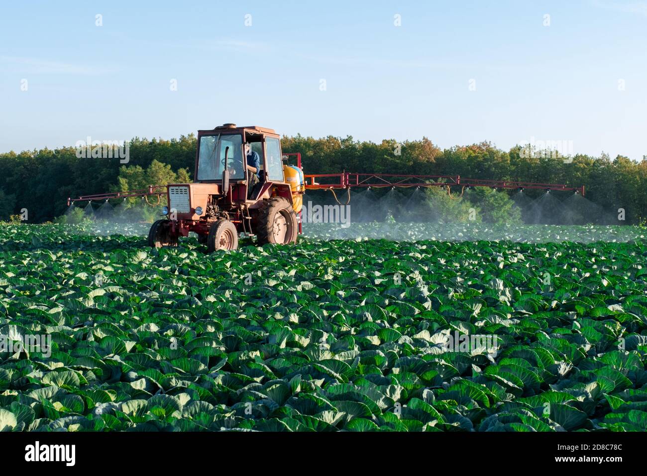 Farmer tractor spraying chemistry crop hi-res stock photography and ...