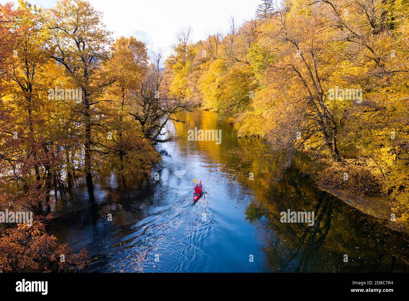 Aerial view of A Kayaker paddling on a beautiful flooded Planina karst ...