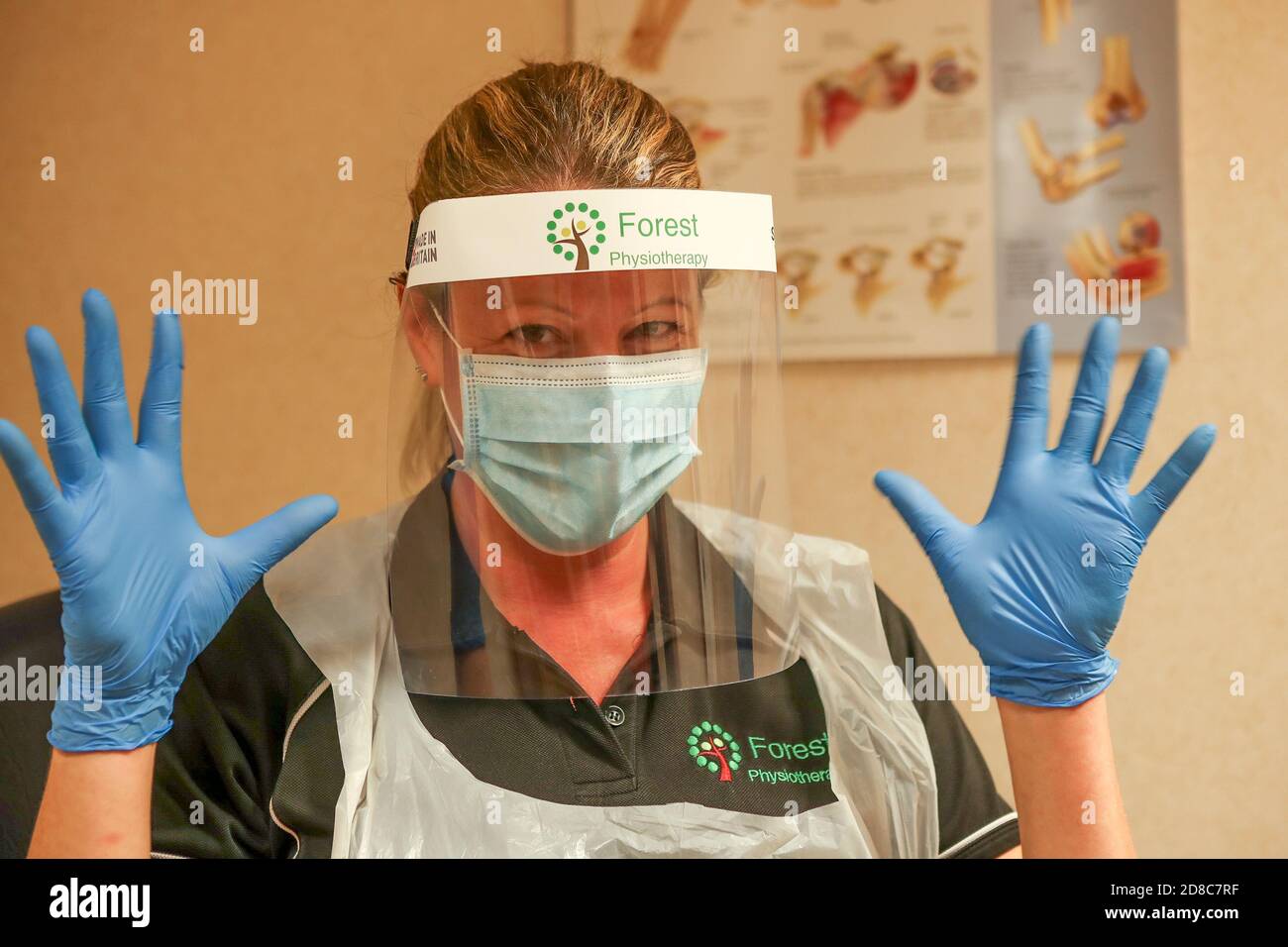 Forest of Dean physiotherapist Fiona Greaves treats a patient wearing a ...