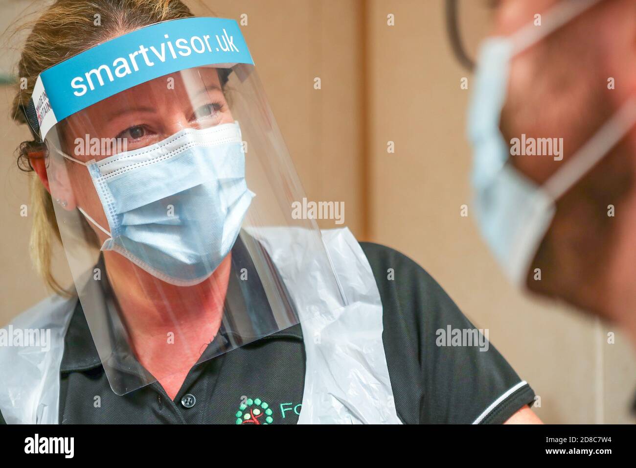 Forest of Dean physiotherapist Fiona Greaves treats a patient wearing a ...