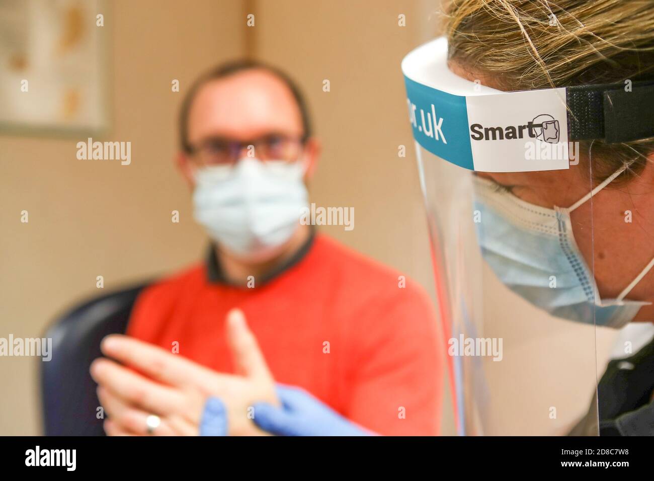 Forest of Dean physiotherapist Fiona Greaves treats a patient wearing a ...