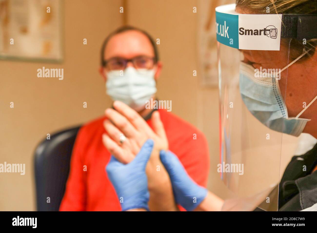 Forest of Dean physiotherapist Fiona Greaves treats a patient wearing a ...