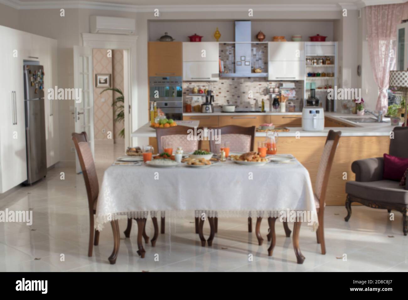 Dinner Table and Kitchen-Blurred Background Stock Photo - Alamy