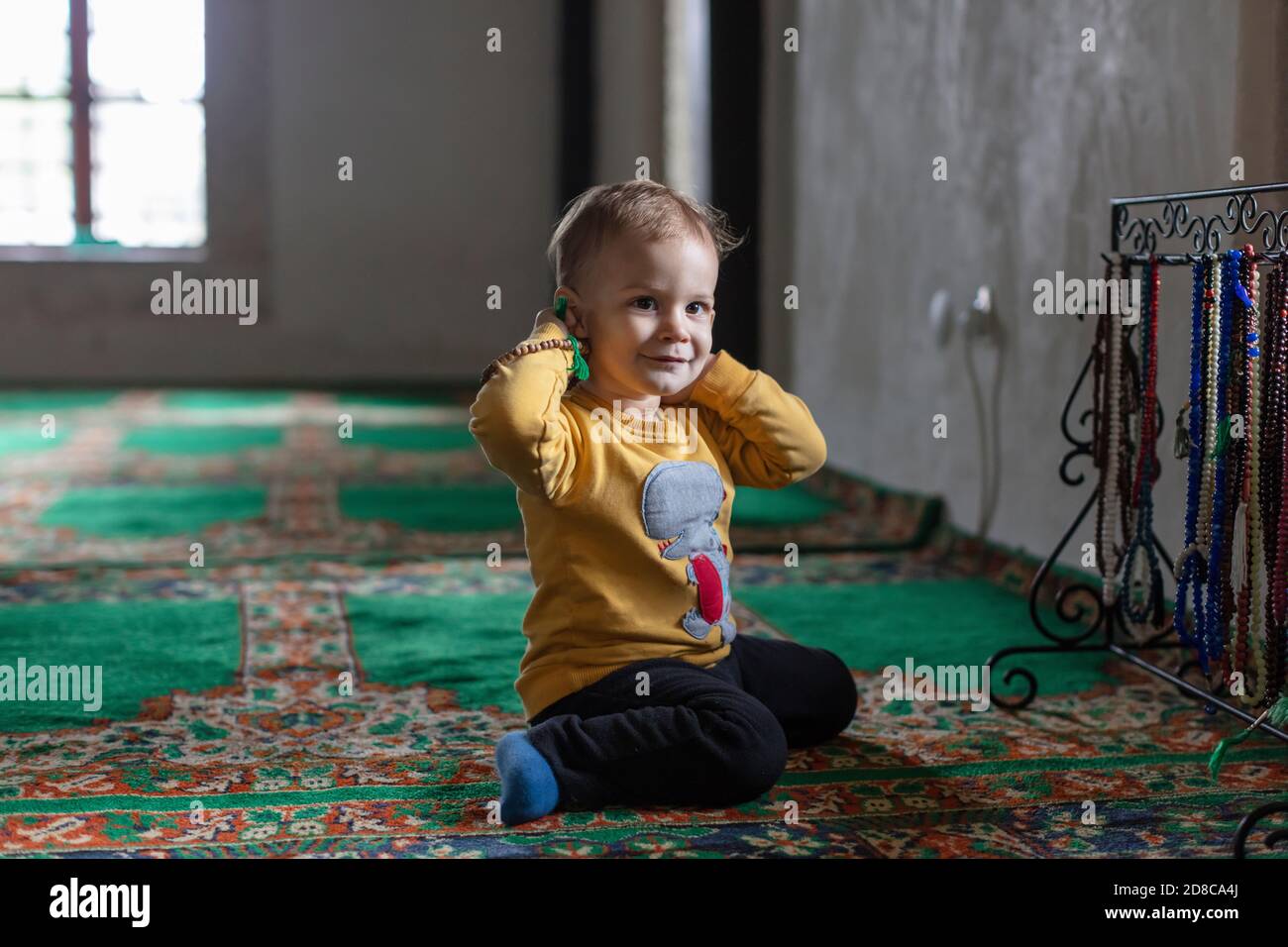A Baby Boy at Mosque Stock Photo - Alamy