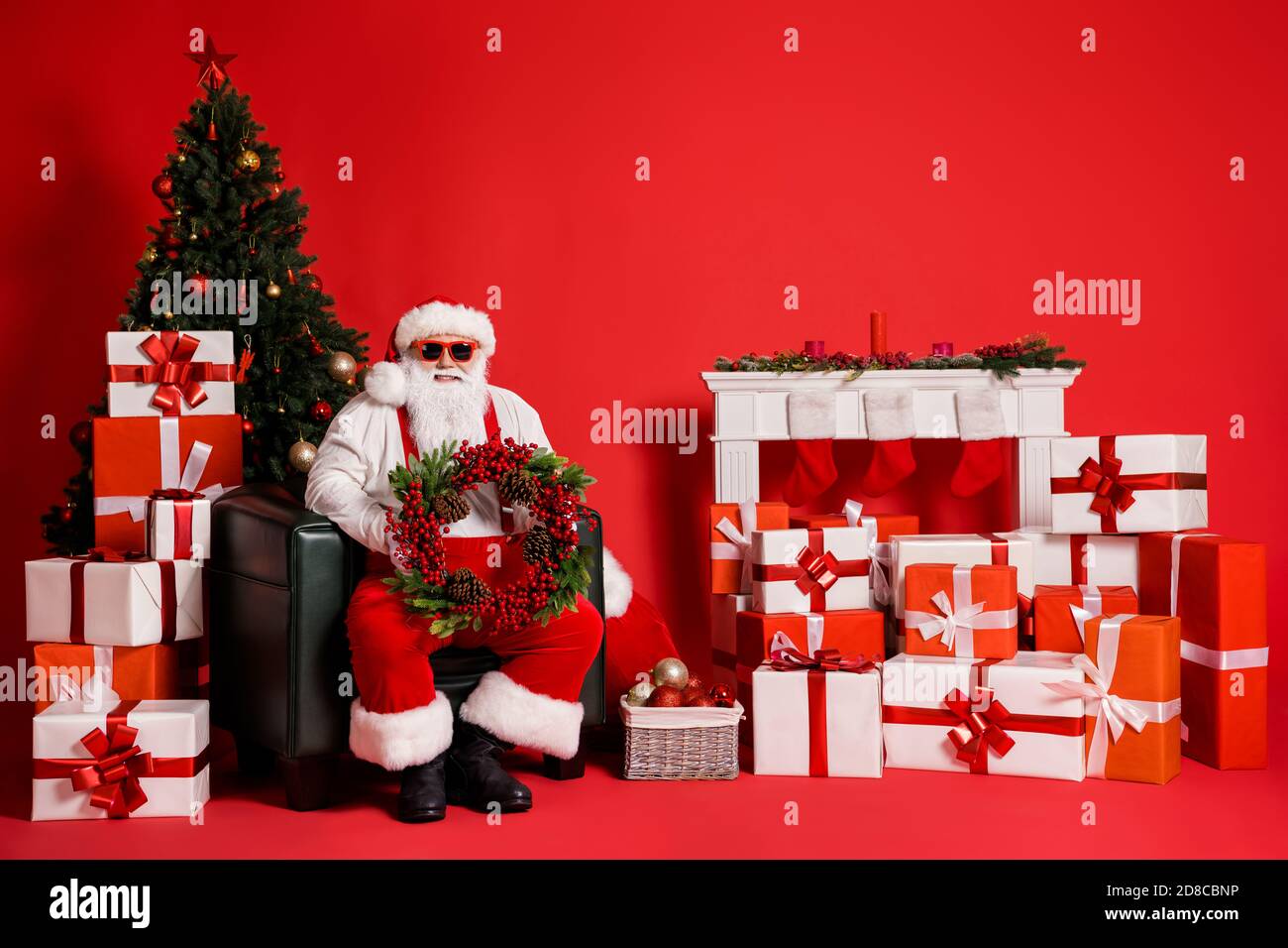 Nice attractive fat overweight cheerful Santa father sitting in ...