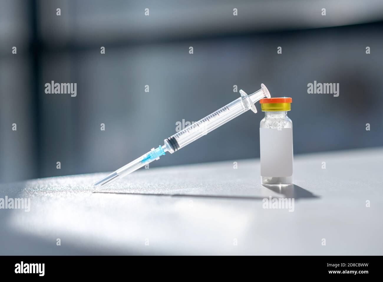 Picture of a syringe and a vial with medicine on the table Stock Photo ...