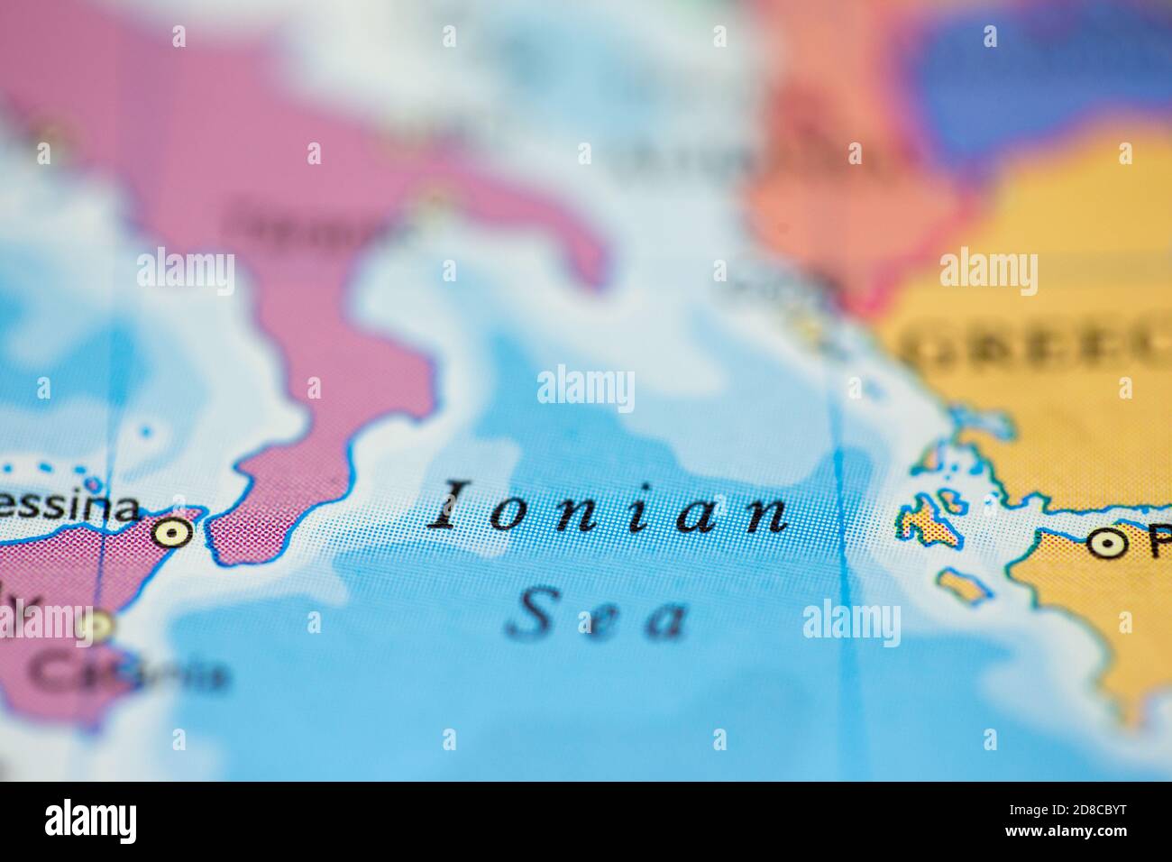 Shallow depth of field focus on geographical map location of Ionian Sea ...