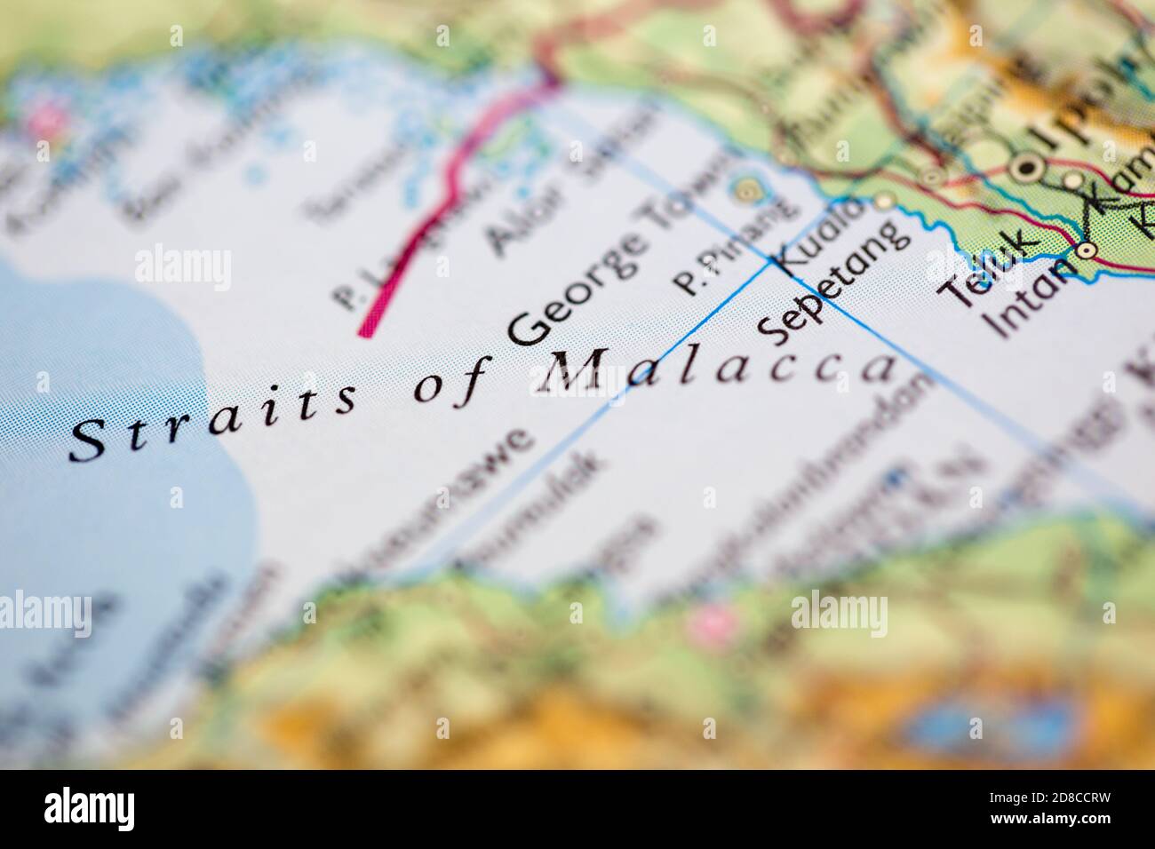Shallow depth of field focus on geographical map location of Straits of ...