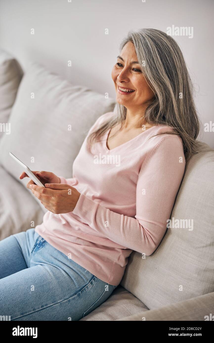 Happy smiling female spending hi-res stock photography and images - Alamy