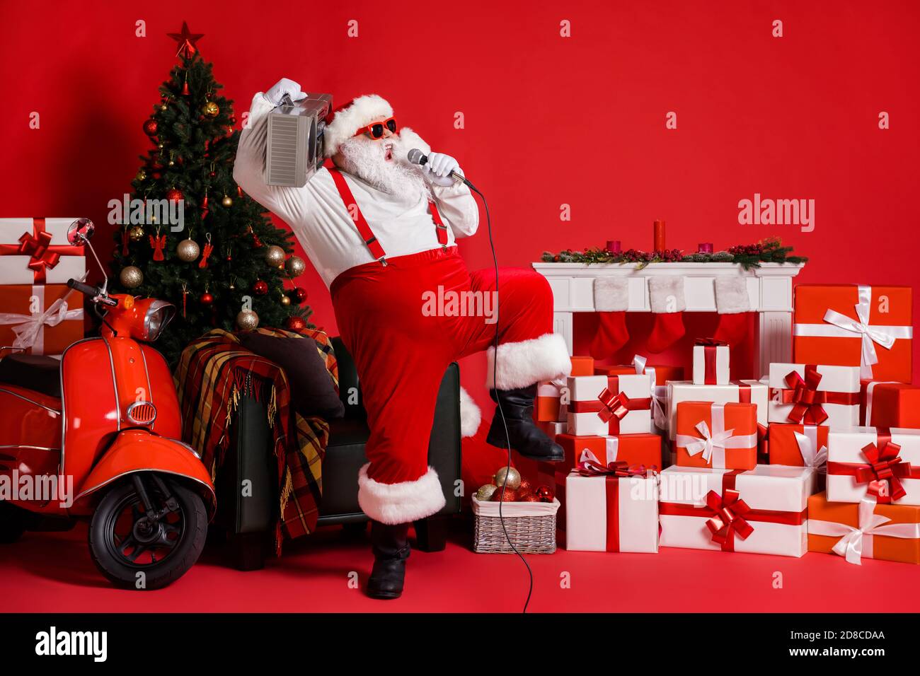 Full length photo of crazy santa claus in costume hold boom box sing ...