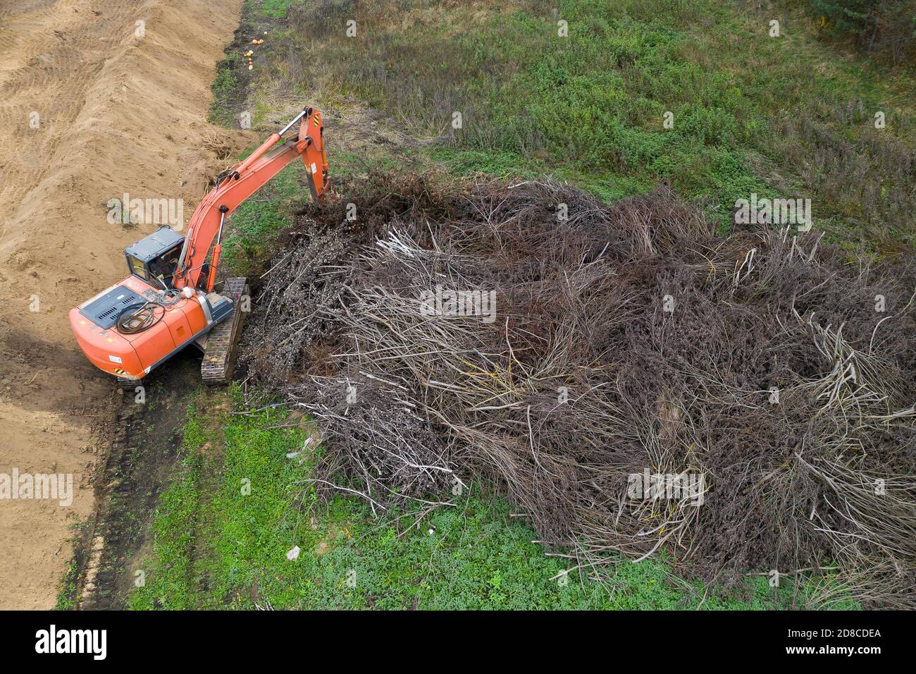 excavator working in a swamp top view from a drone Stock Photo - Alamy