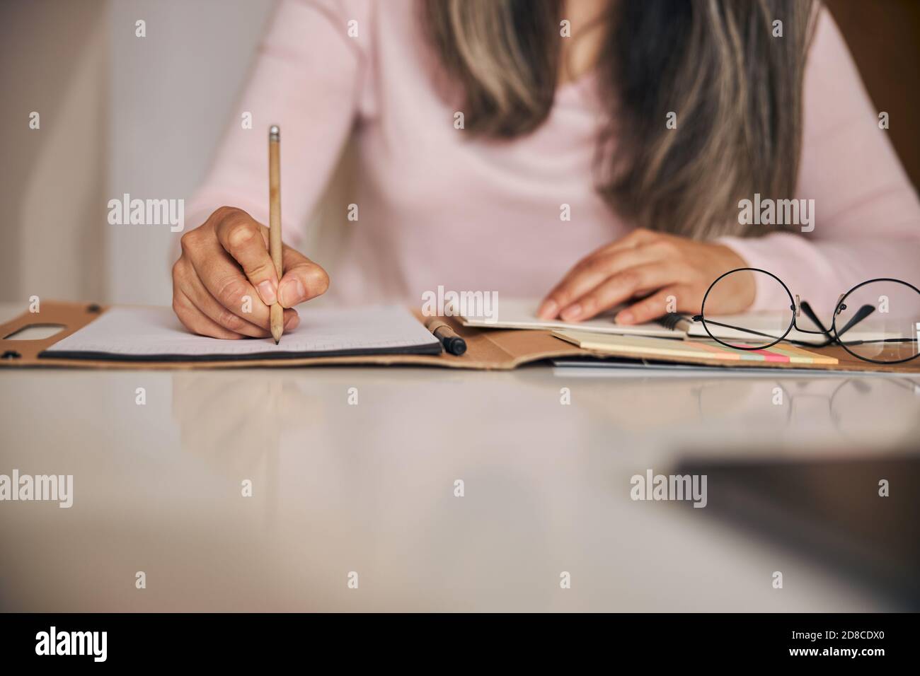 Woman filling out form by hand hi-res stock photography and images - Alamy