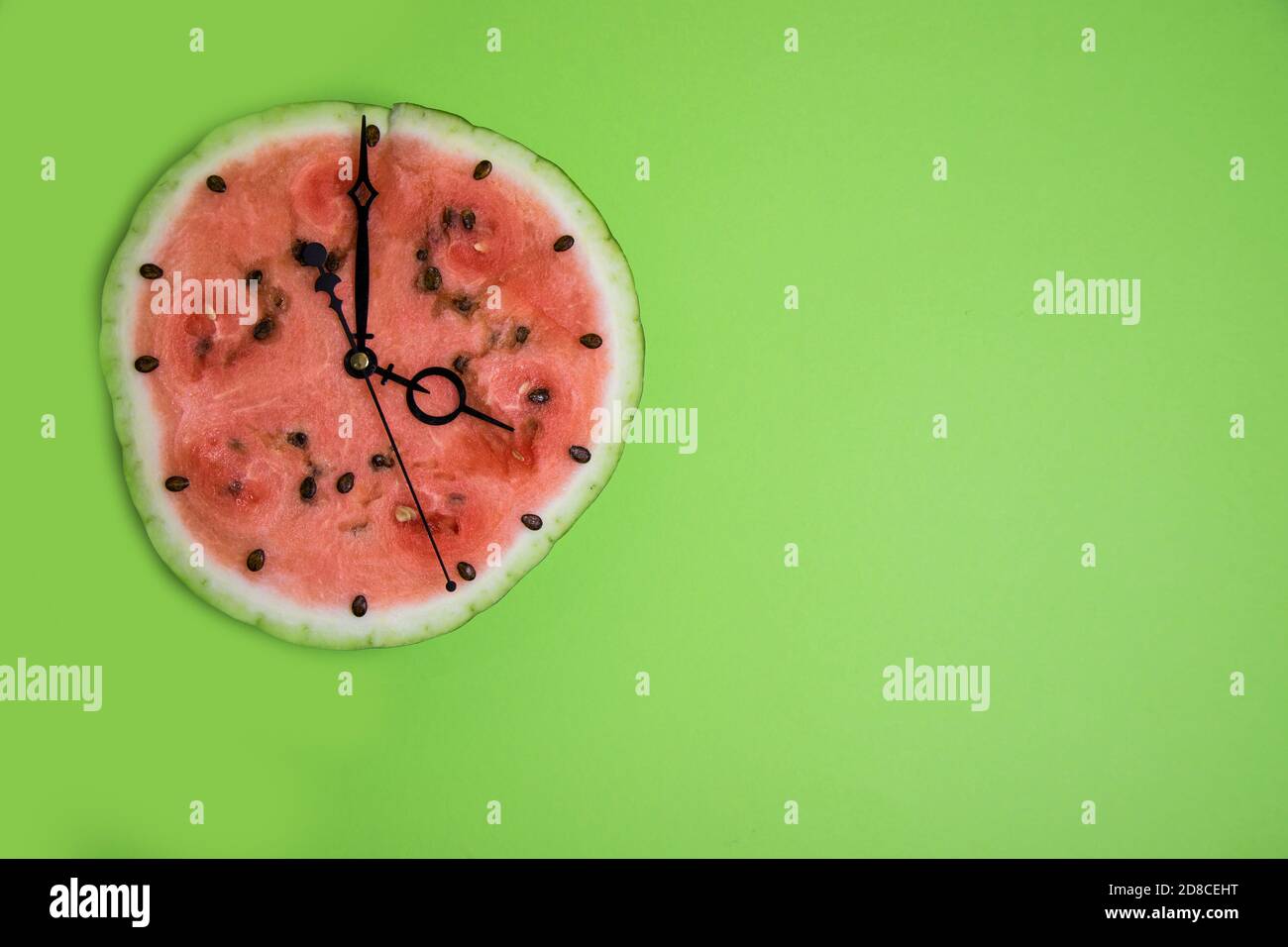 Watermelon slice with arrows showing four o'clock on the clock, green ...