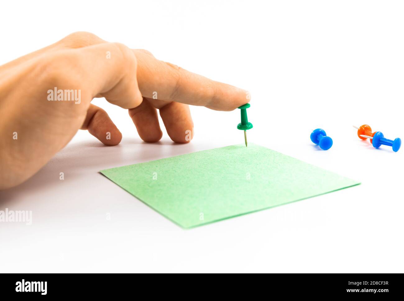 Man fixing sheet of paper on a stationery pin on white isolated ...