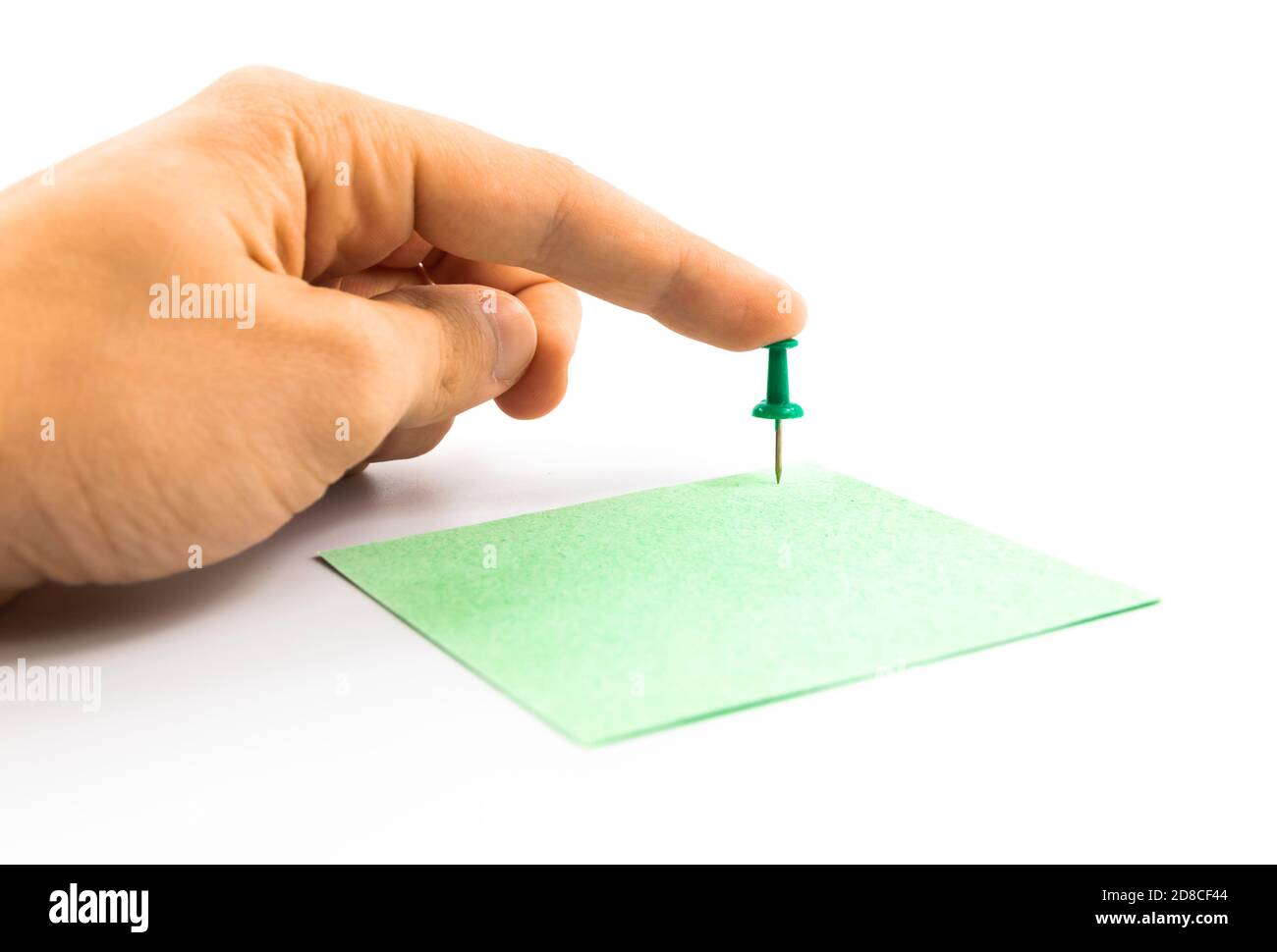 Man attaches sheet of paper to a stationery pin on white isolated ...