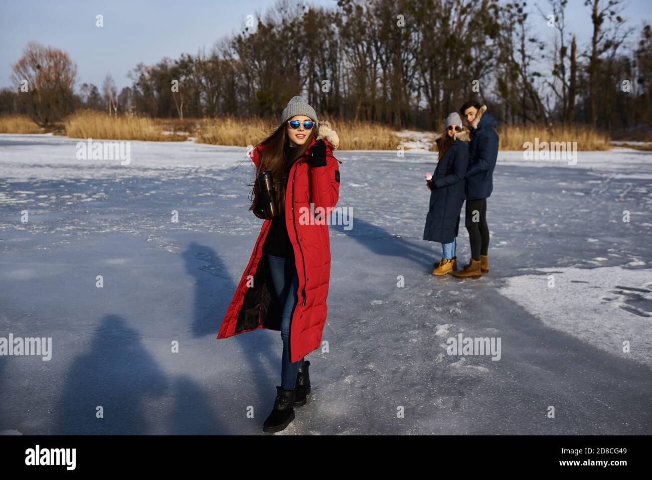Young friends having fun outdoors in winter time. Concept of friendship and fun with new trends ...