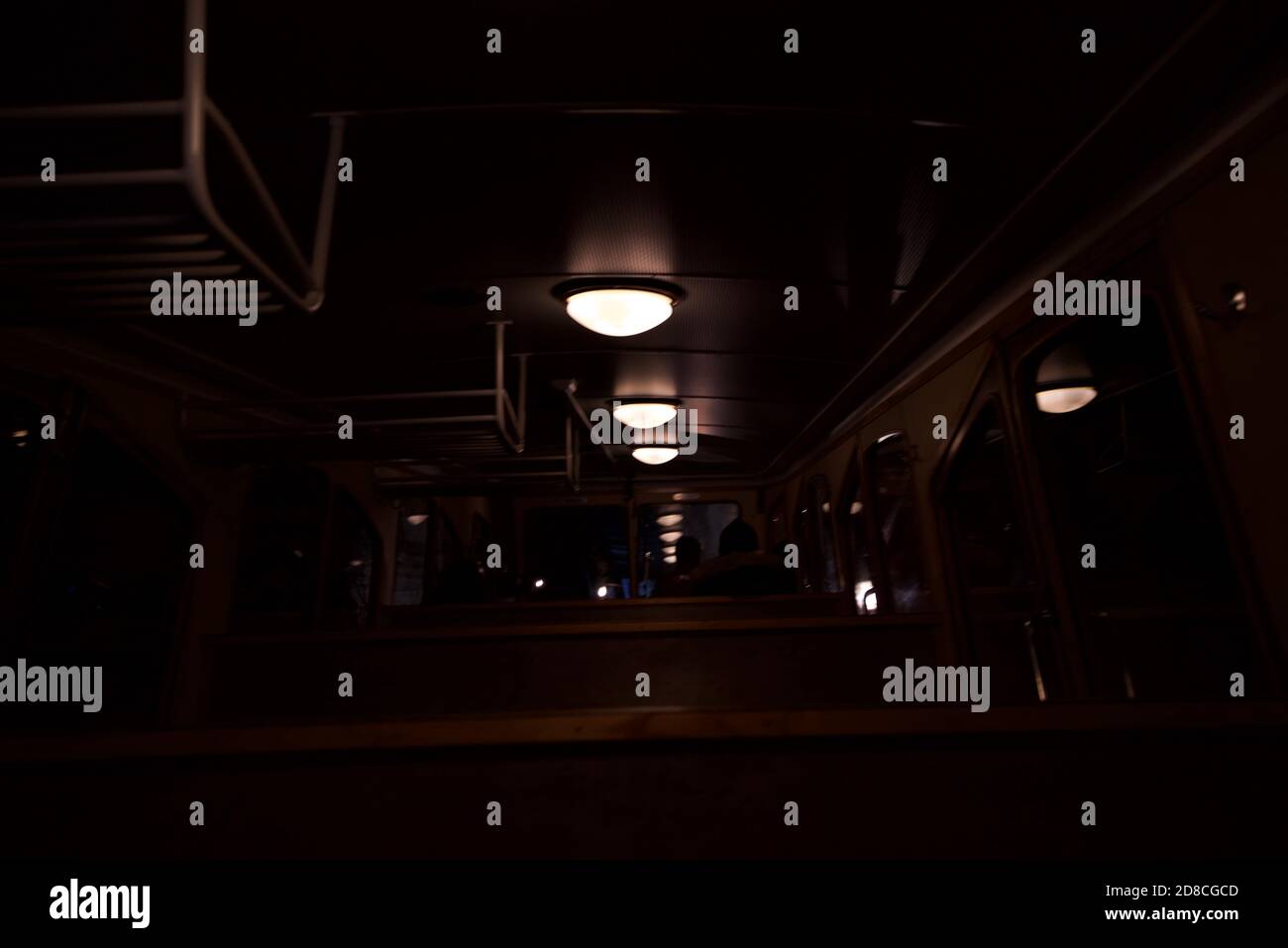 Shot inside the train cabin only with the dim lights inside a tunnel ...