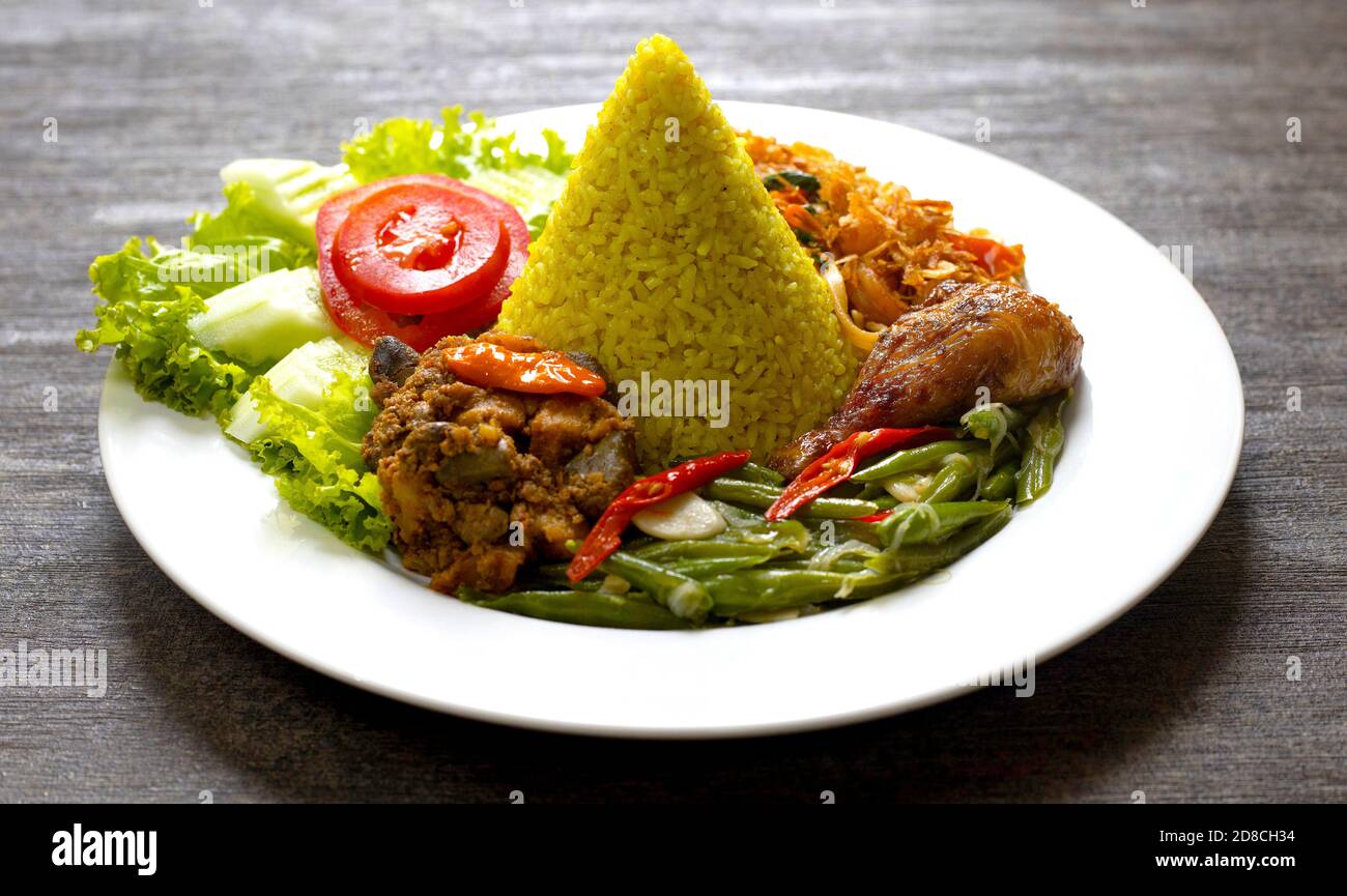 Delicious and tasty Yellow Rice with chicken and vegetables Stock Photo ...