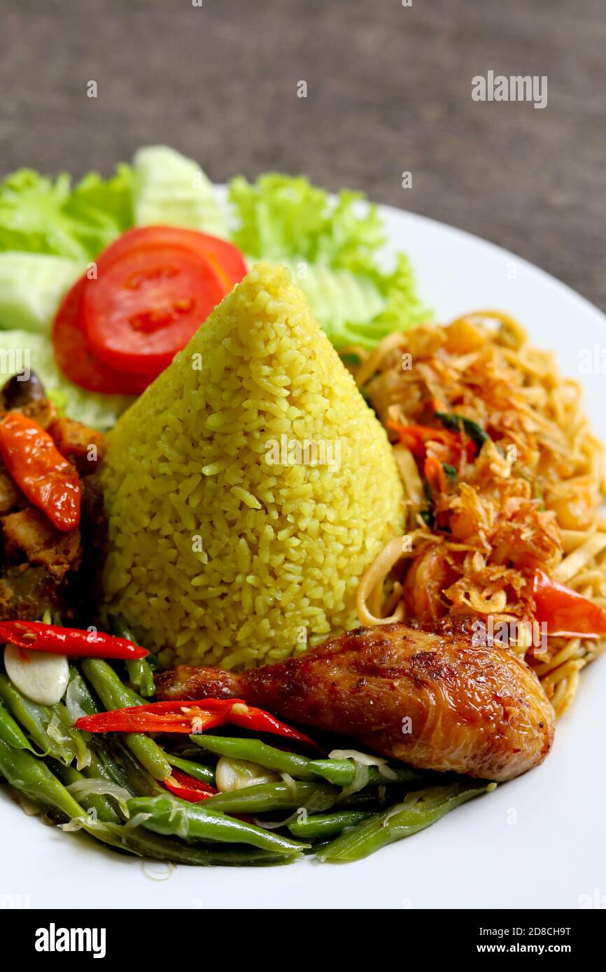 Delicious and tasty Yellow Rice with chicken and vegetables Stock Photo ...