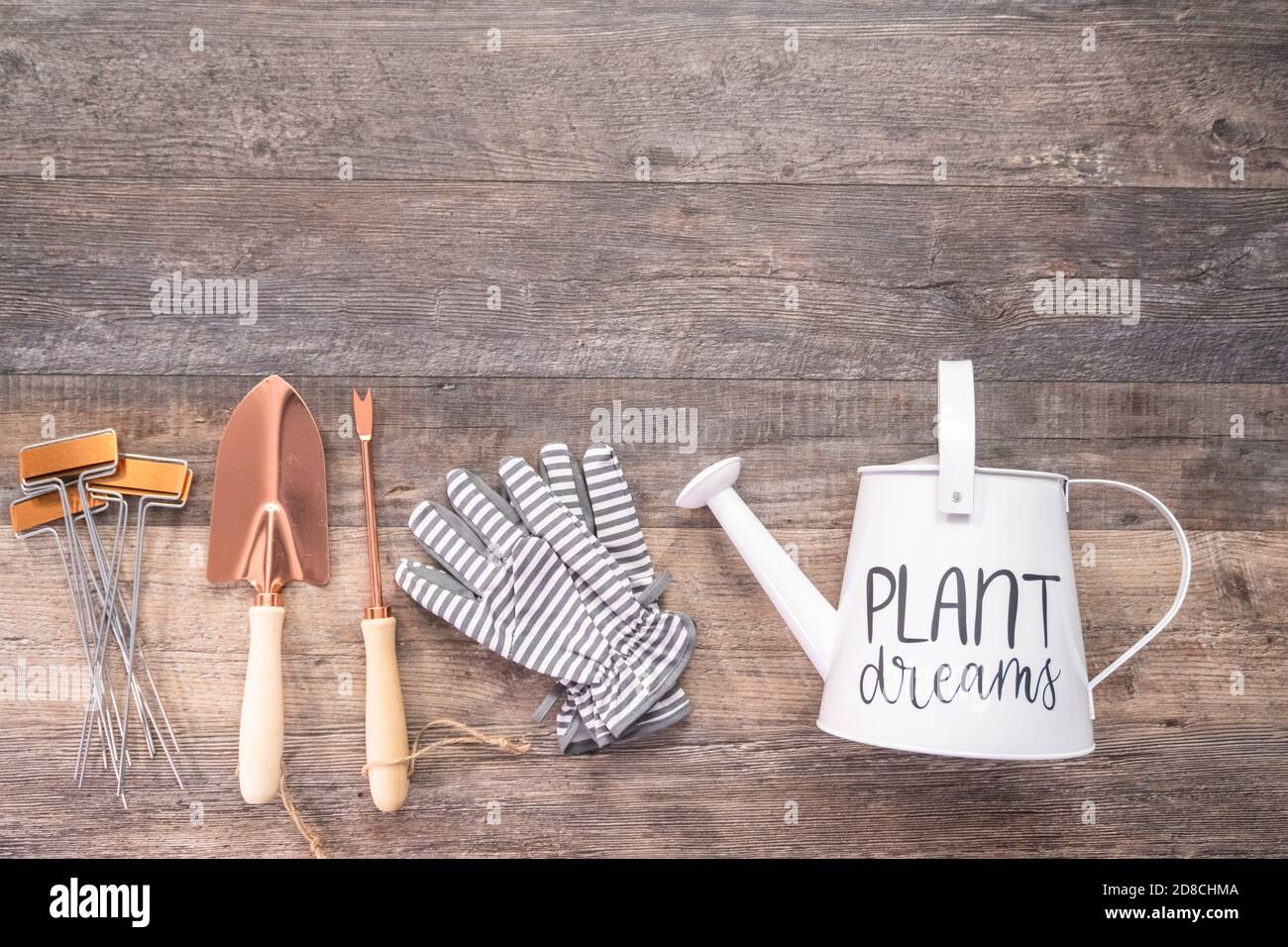 Flat lay. Small garden tools are ready for Spring planting season ...