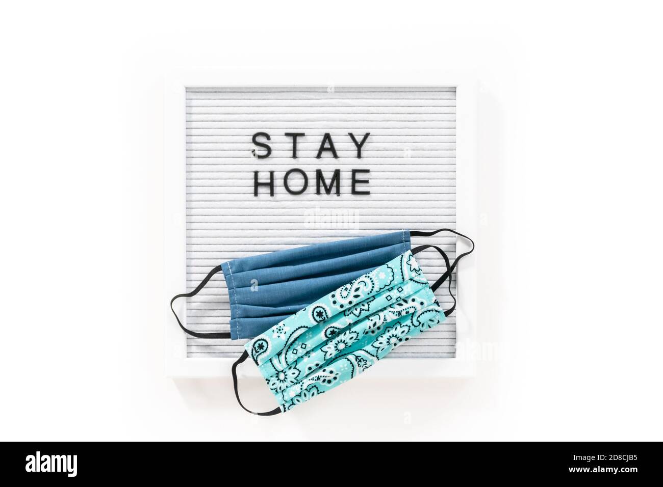 STAY HOME sign on message board with a homemade face mask Stock Photo ...