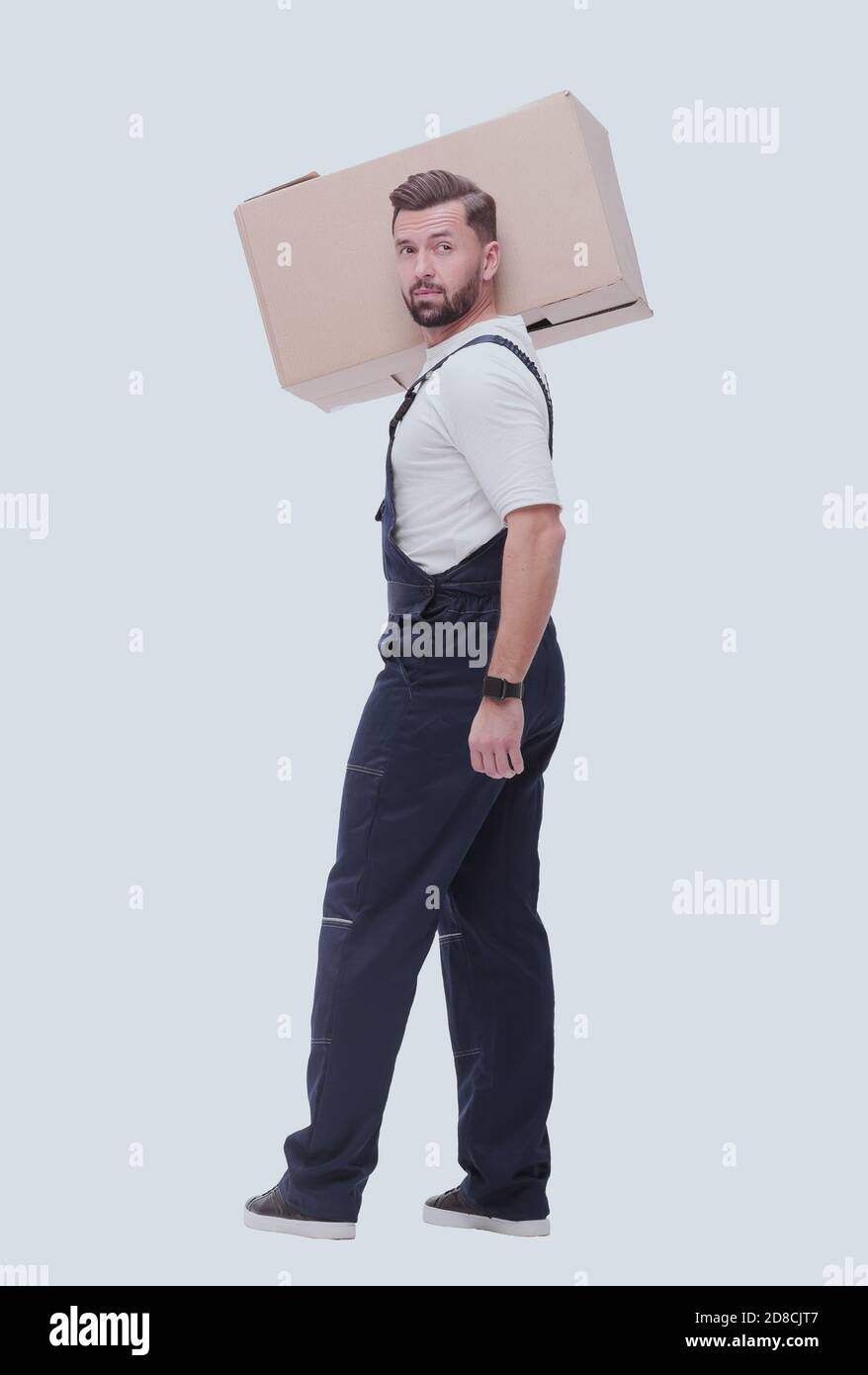 rear view. a young man with a cardboard box looking at the camera Stock ...