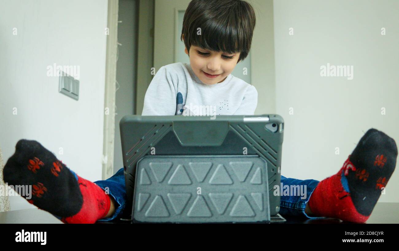 A child browsing on tablet Stock Photo - Alamy