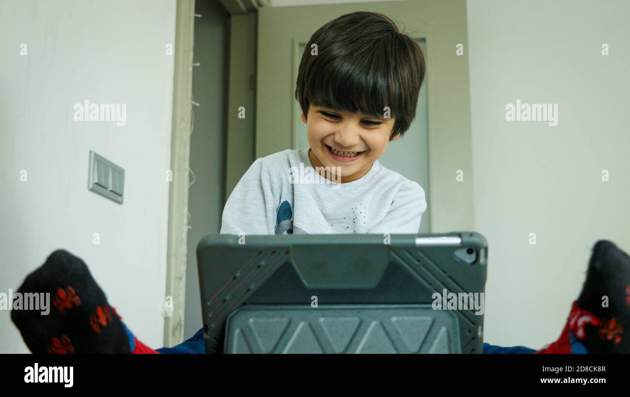 A child browsing on tablet Stock Photo - Alamy