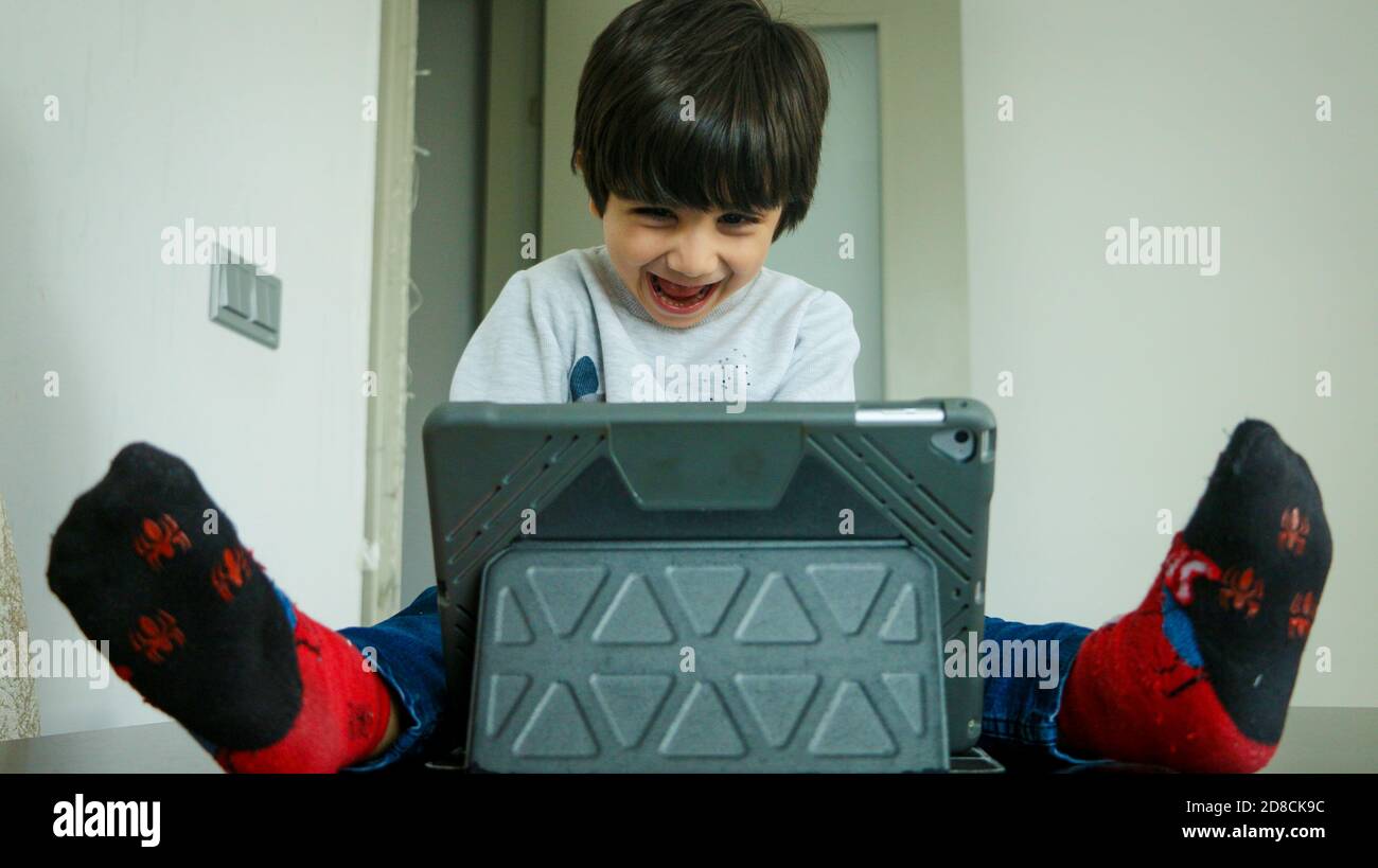 A child browsing on tablet Stock Photo - Alamy