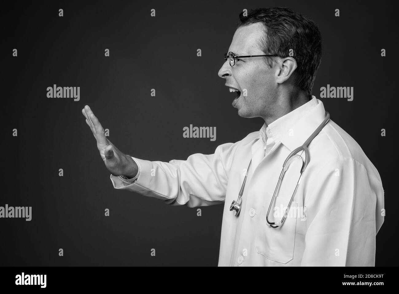 Doctor warning Black and White Stock Photos & Images - Alamy