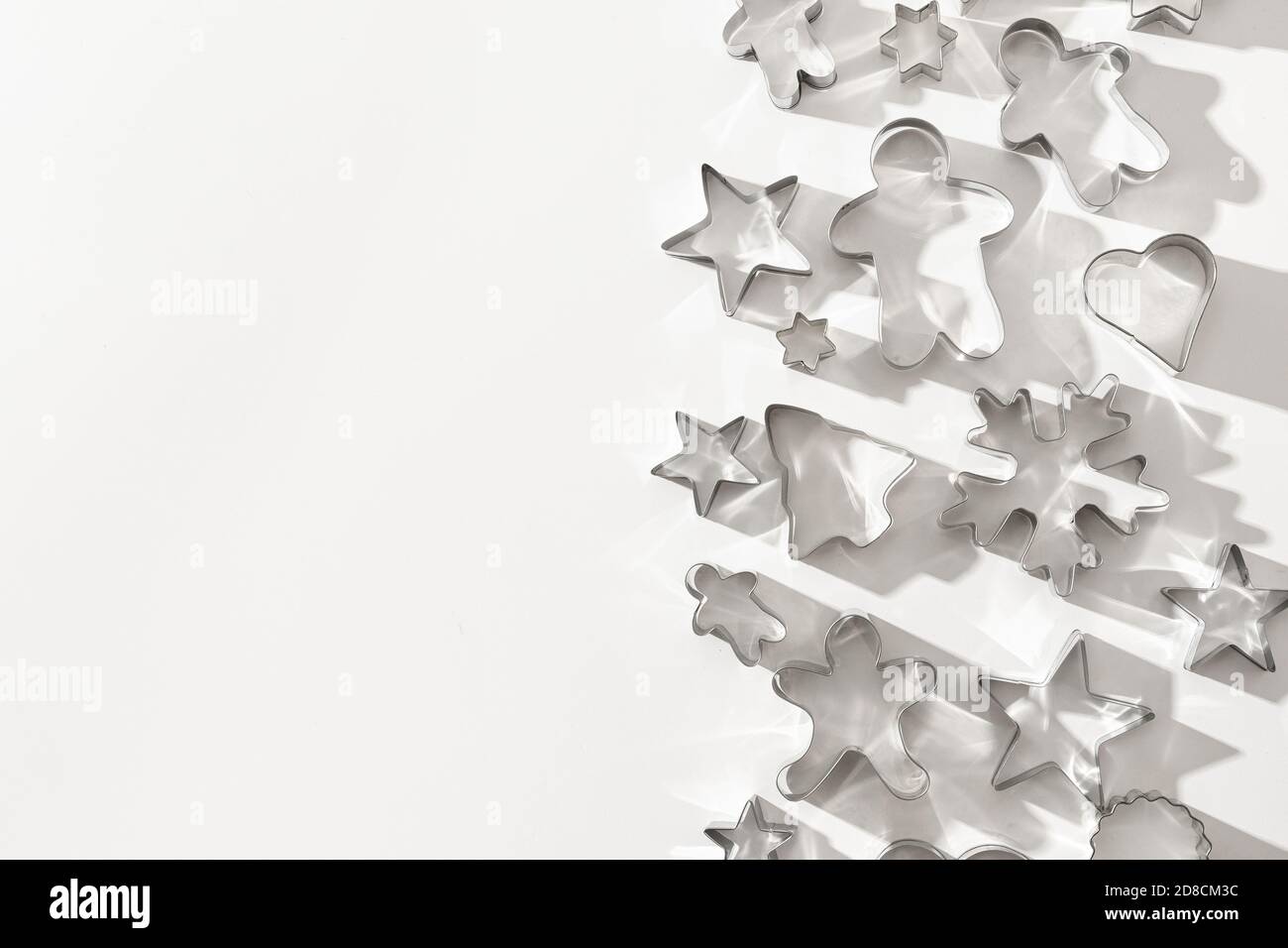 Border of Christmas-themed cookie cutters with shadow. Festive Xmas ...