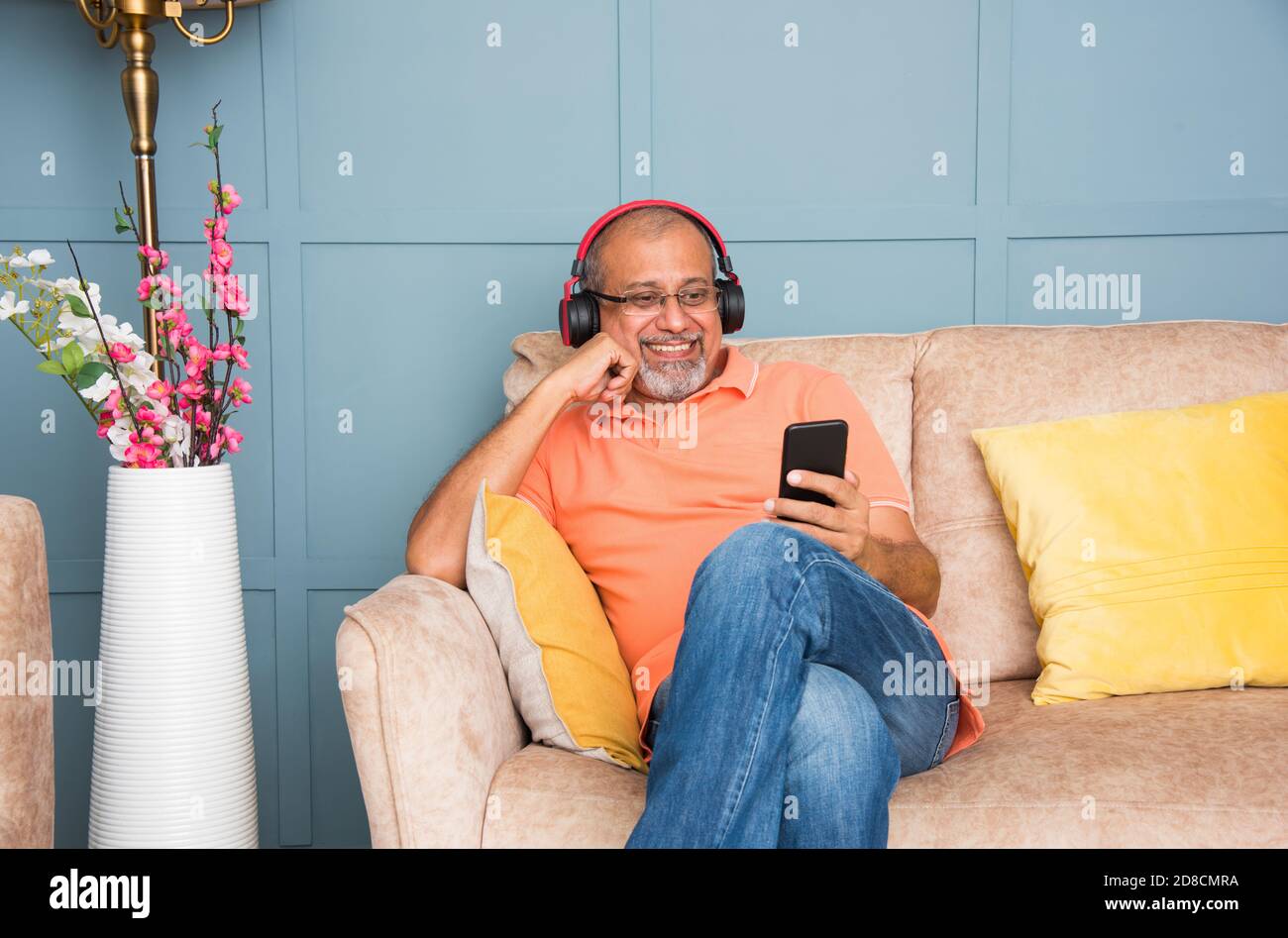 Indian old man listening music hi-res stock photography and images - Alamy