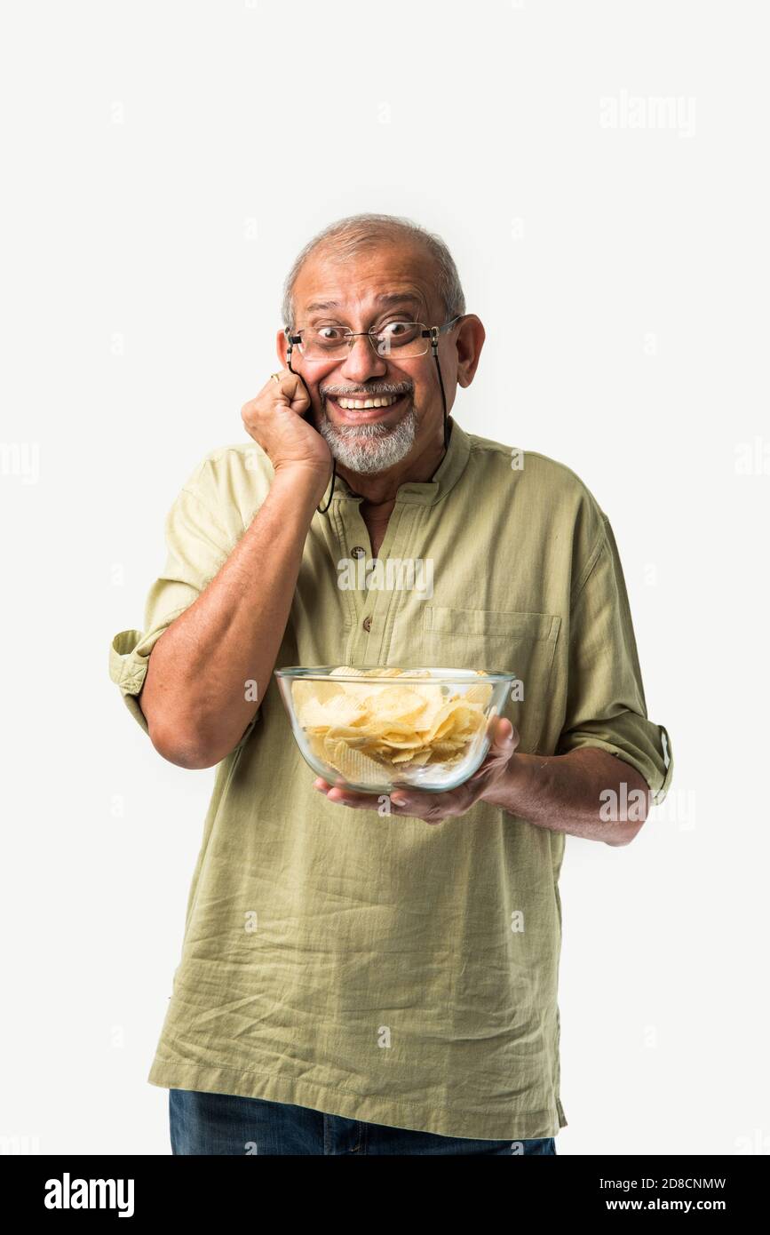 Man eating potato chips hi-res stock photography and images - Alamy